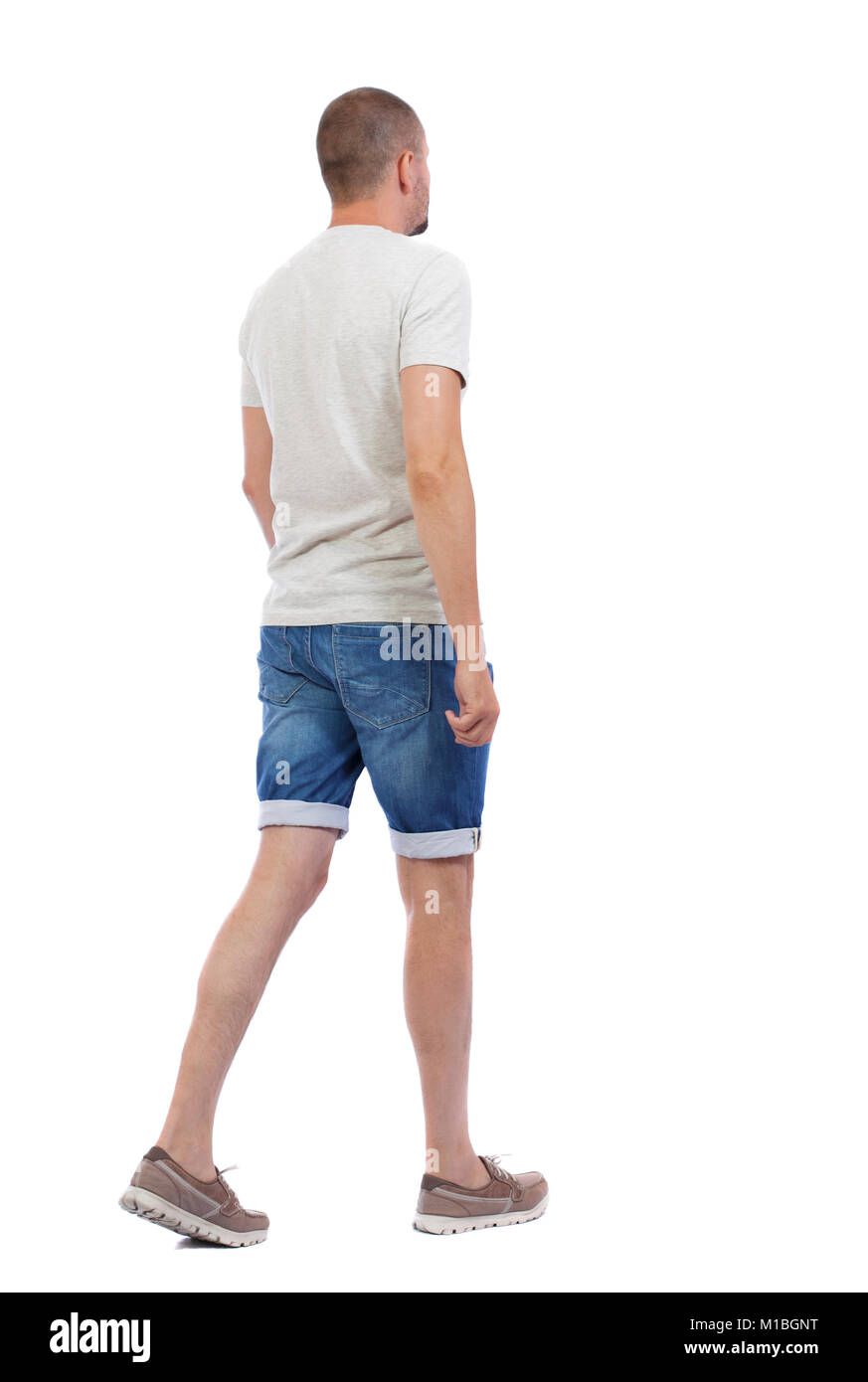 Back view of going handsome man. walking young guy . Rear view people ...