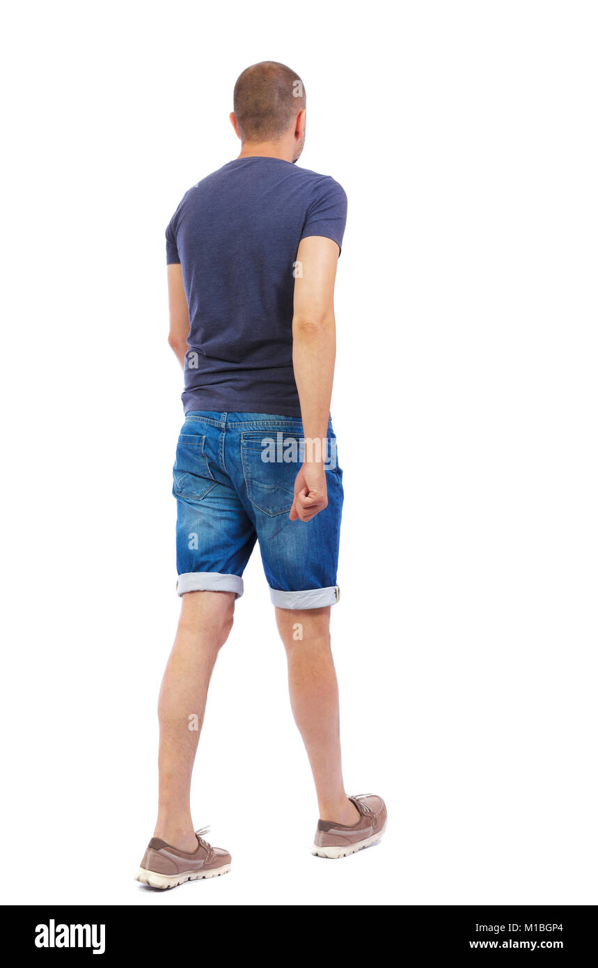 Back view of going handsome man. walking young guy . Rear view people ...