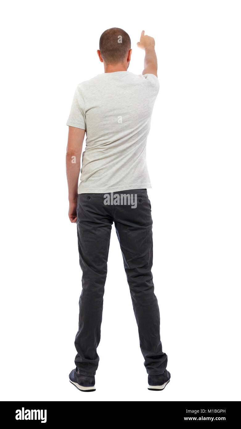 Back view of pointing young men in shirt and jeans. Young guy gesture ...