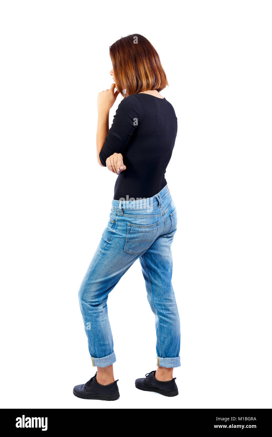 back view of standing young beautiful woman. girl watching. Rear view ...