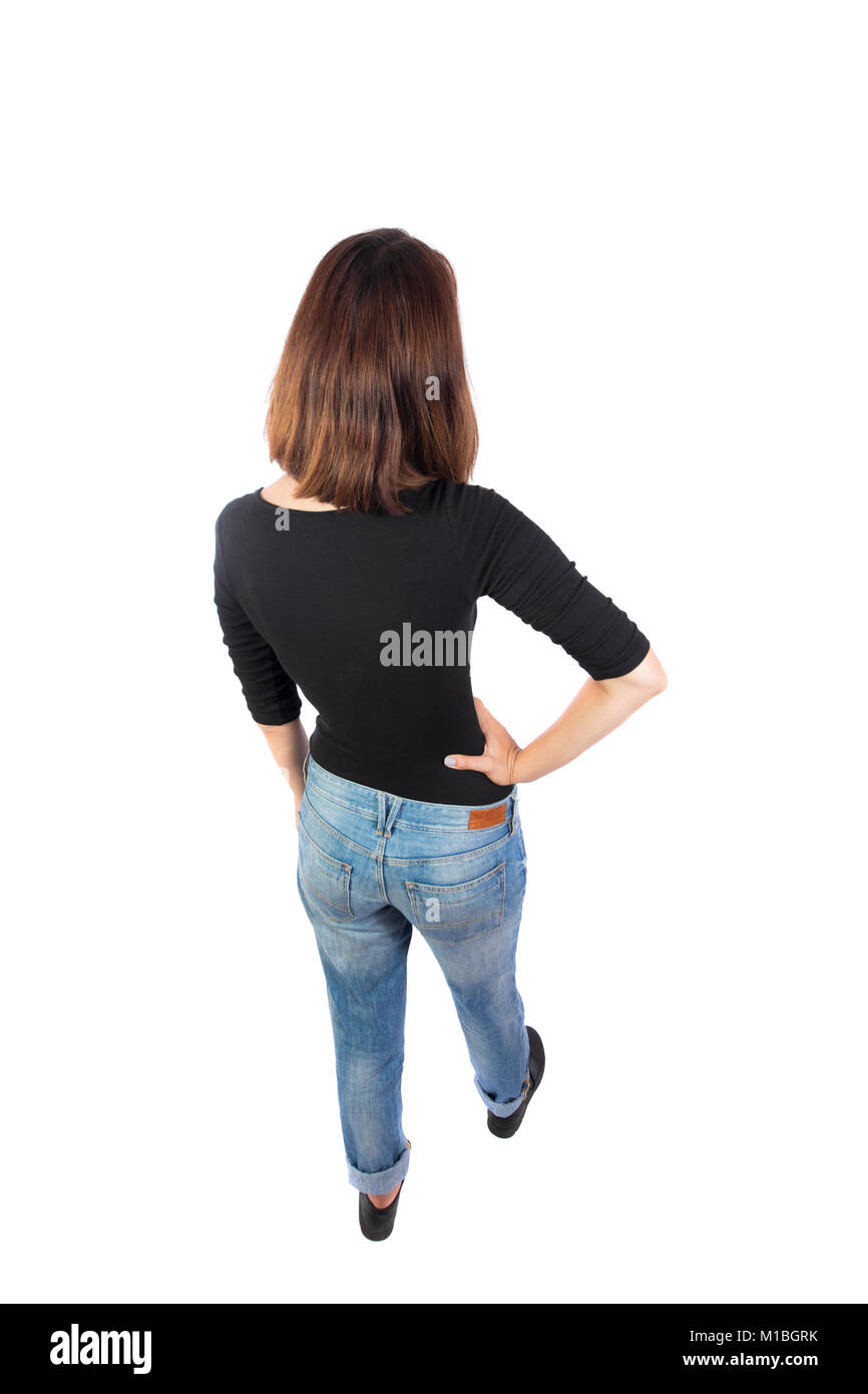 back view of standing young beautiful woman. girl watching. Rear view ...