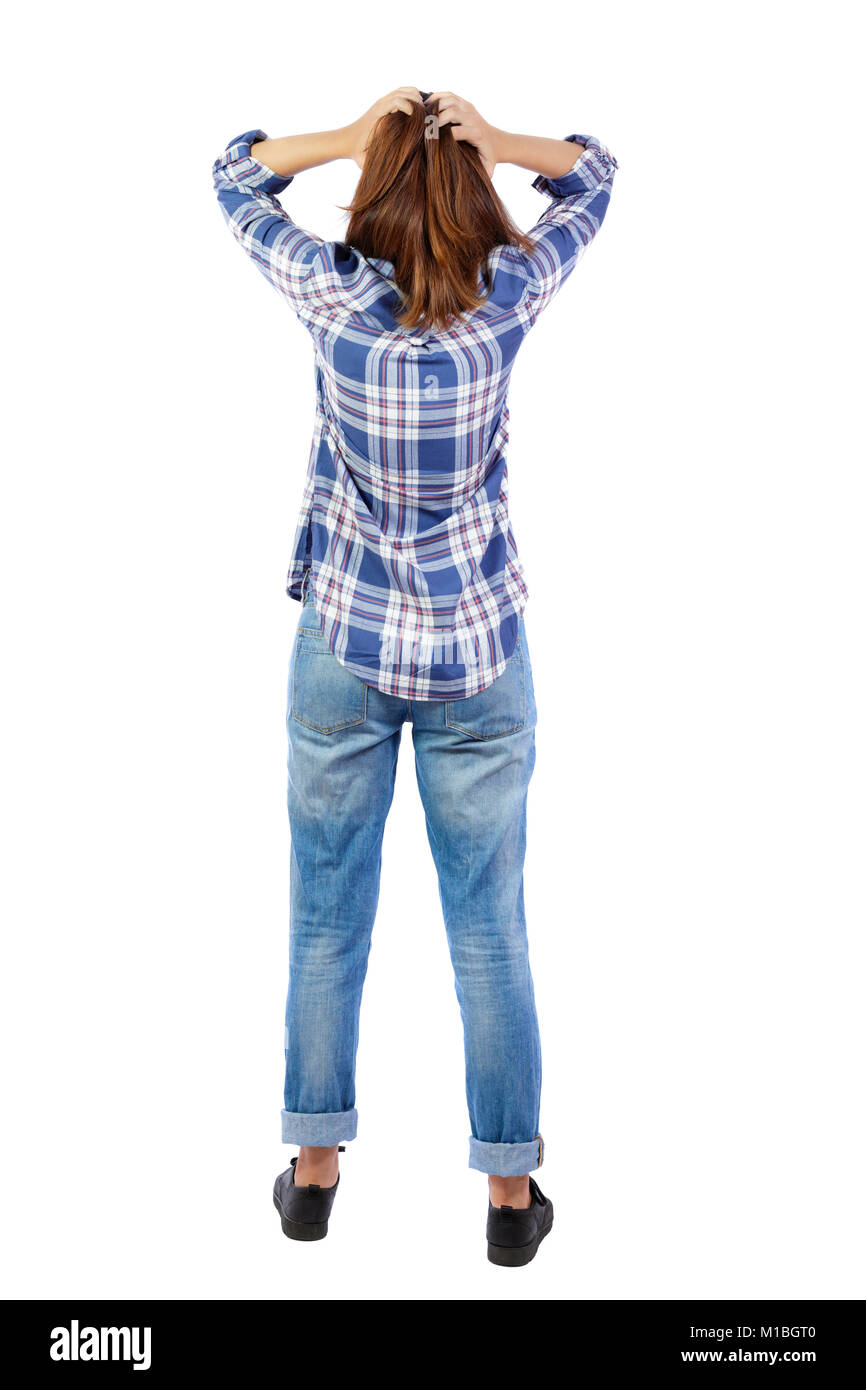 Back view of shocked woman in jeans. upset young girl. Rear view people ...