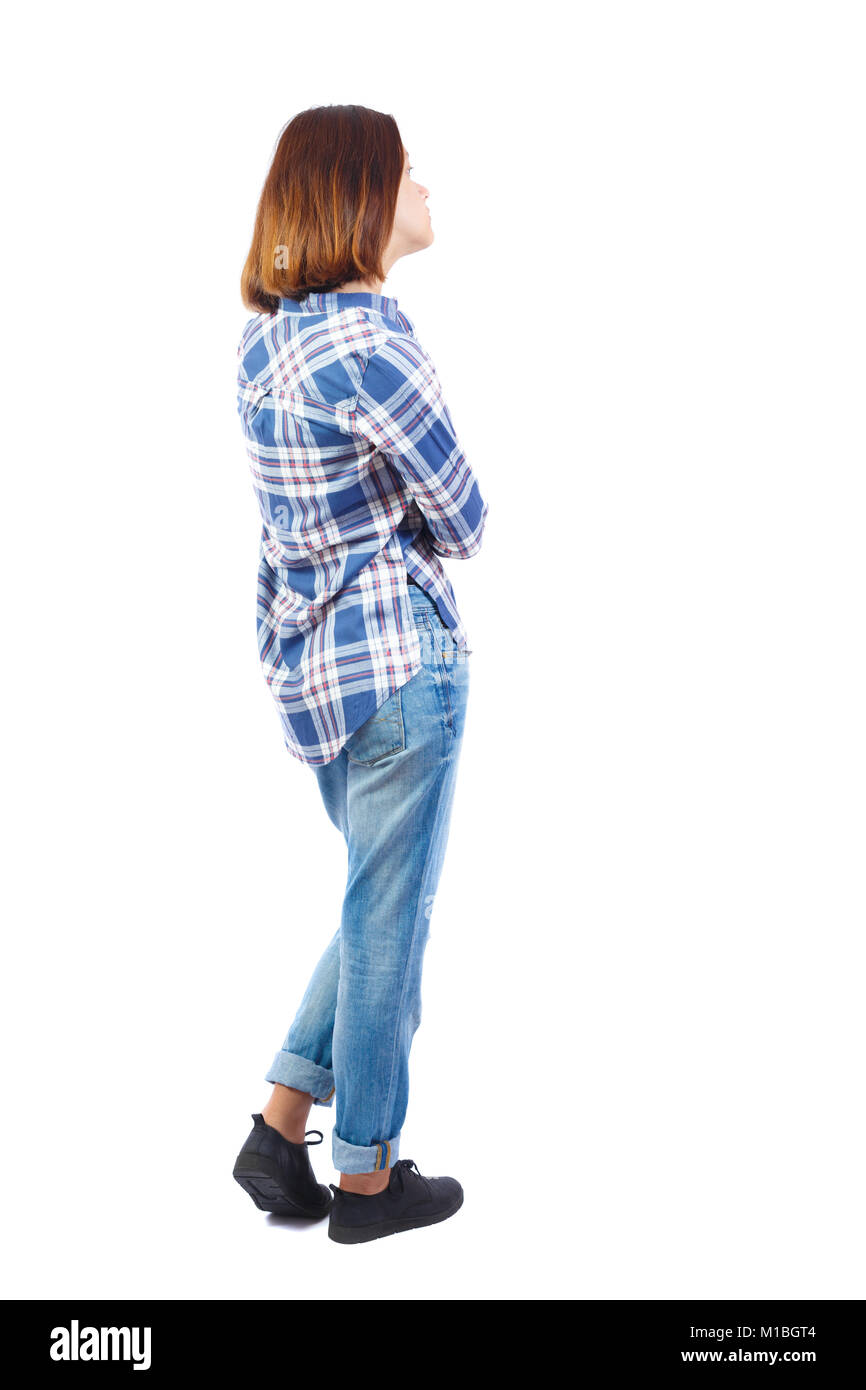 back view of standing young beautiful woman. girl watching. Rear view ...