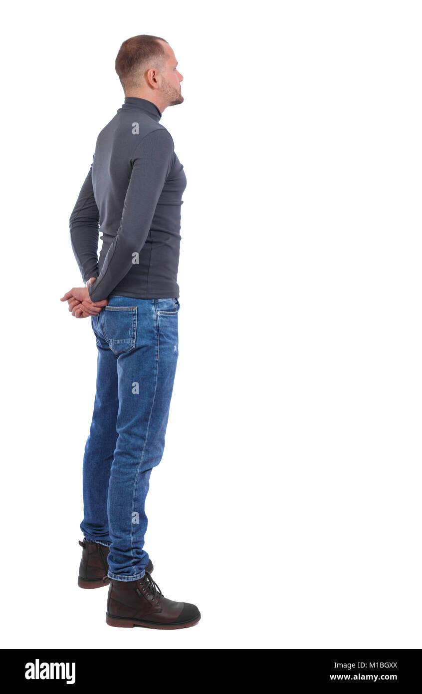 Back view of man in jeans. Standing young guy. Rear view people ...