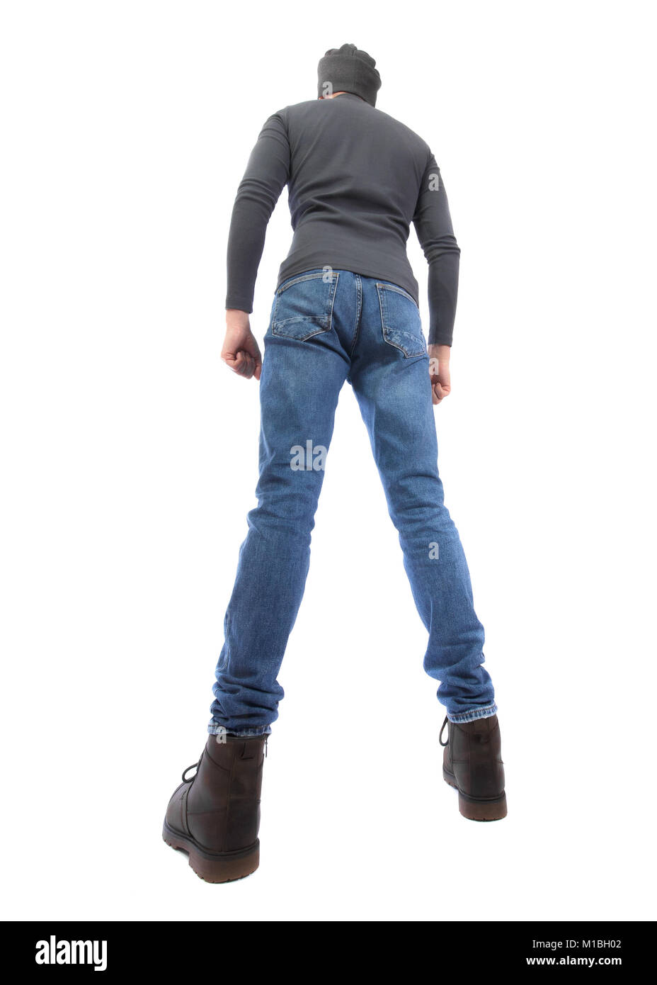Back view of man in jeans. Standing young guy. Rear view people ...