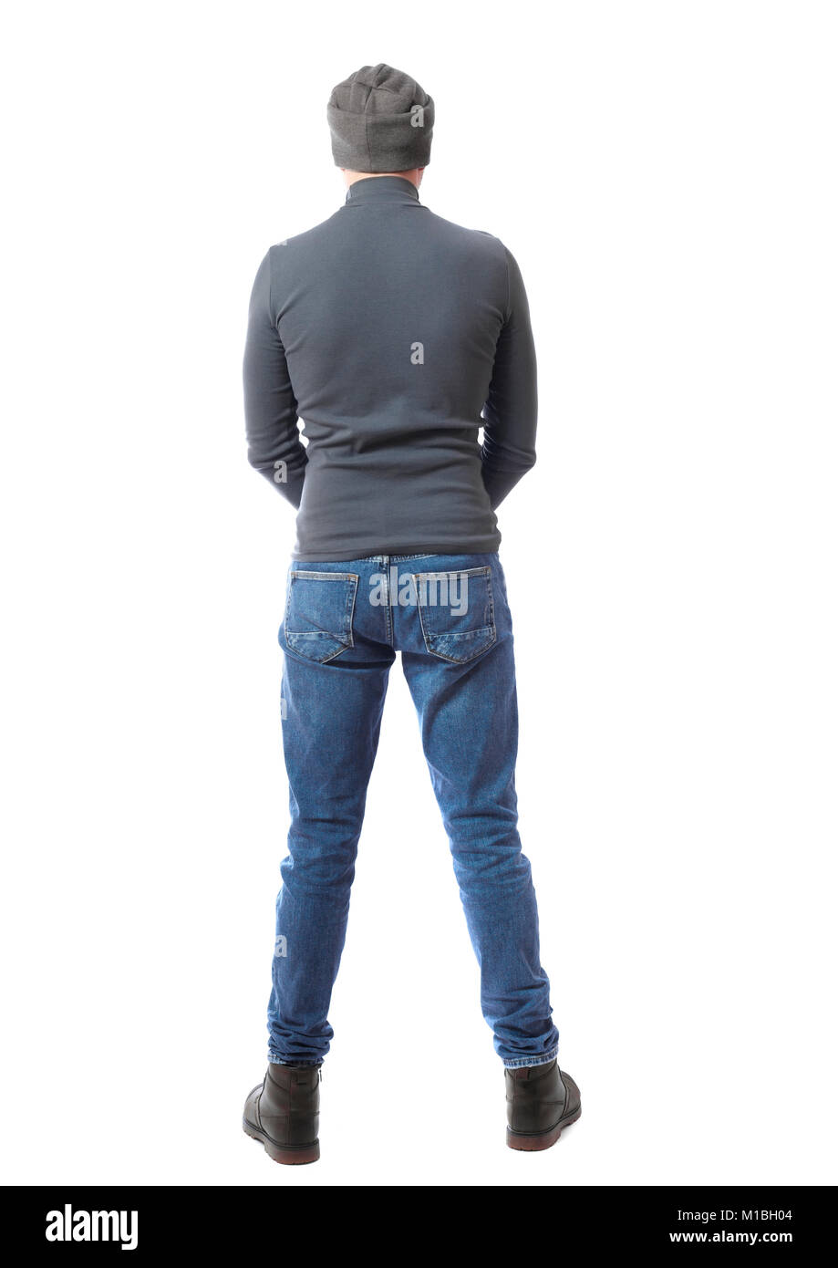 Back view of man in jeans. Standing young guy. Rear view people ...