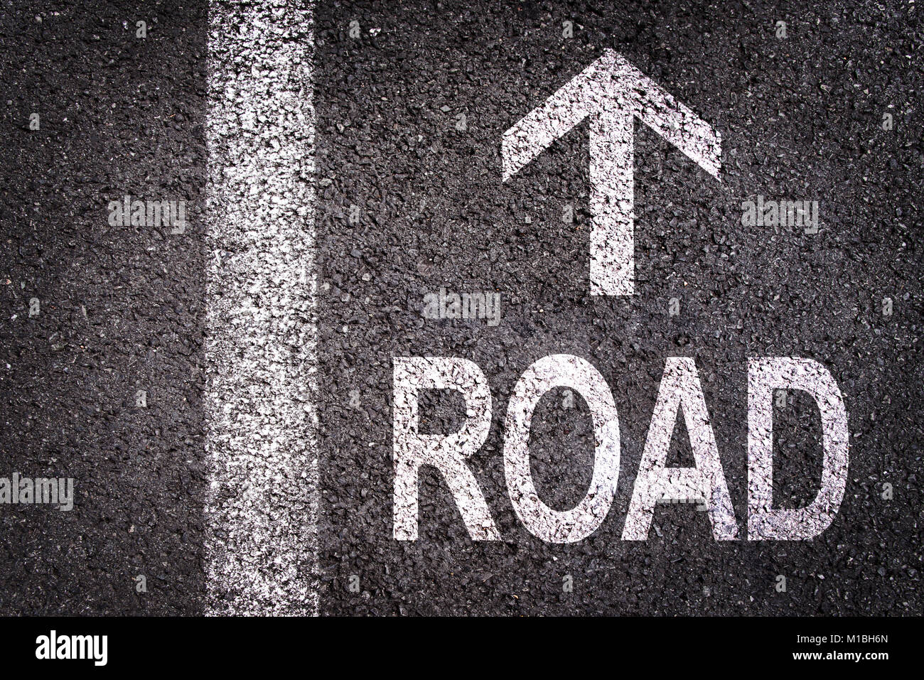 Word road and an arrow written on an asphalt road background Stock ...
