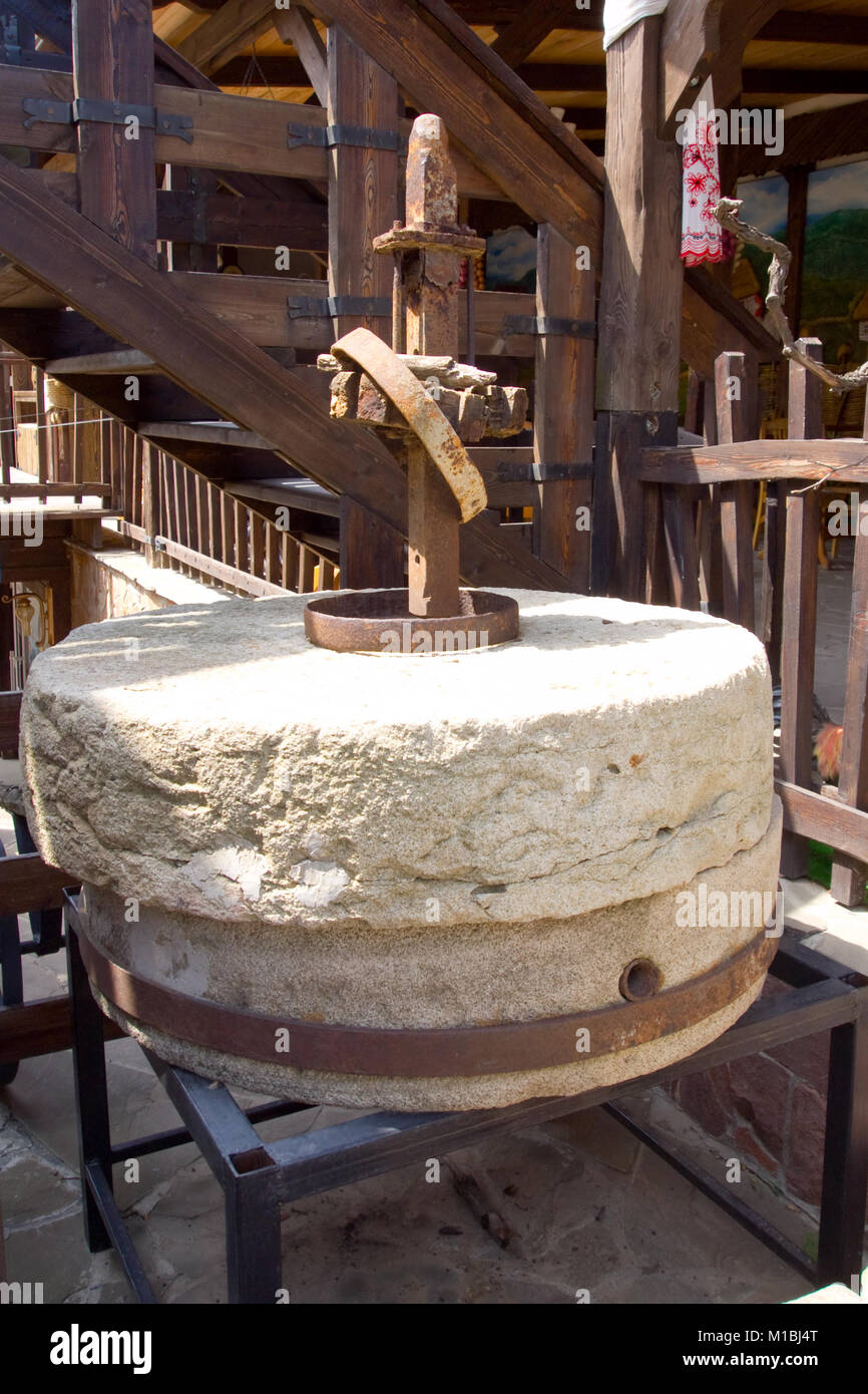 Stone millstone old mill Stock Photo - Alamy