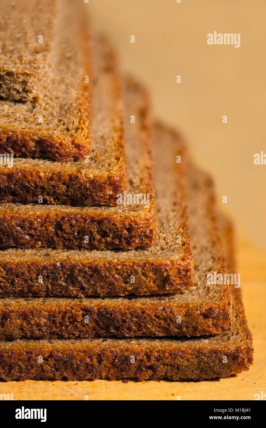 pieces of rye bread stacked pyramid Stock Photo - Alamy