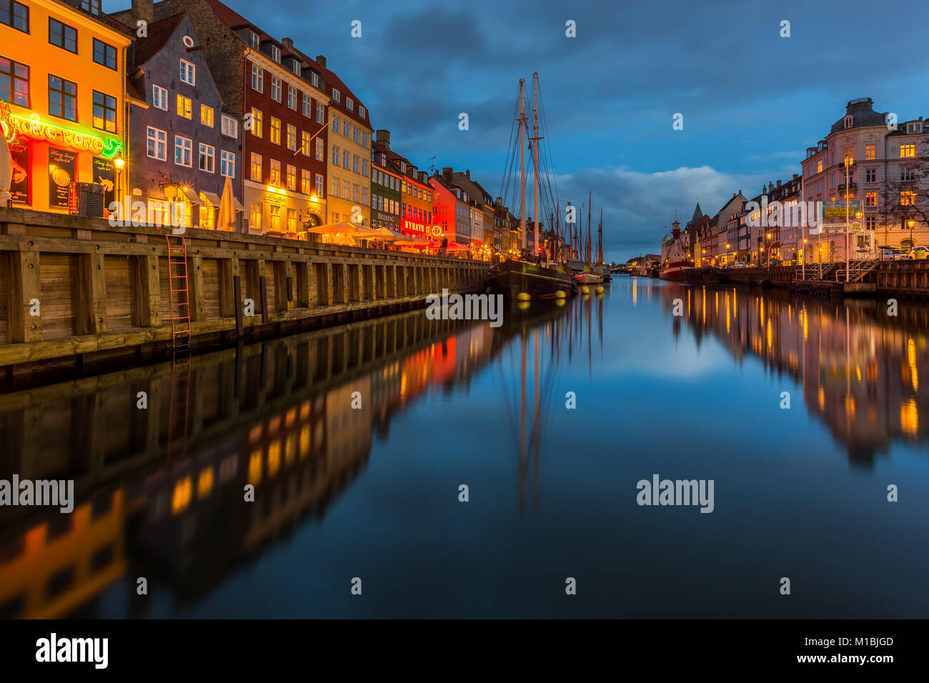 COPENHAGEN, DENMARK - FEBRUARY 28, 2017: Nyhavn at night. A 17th ...