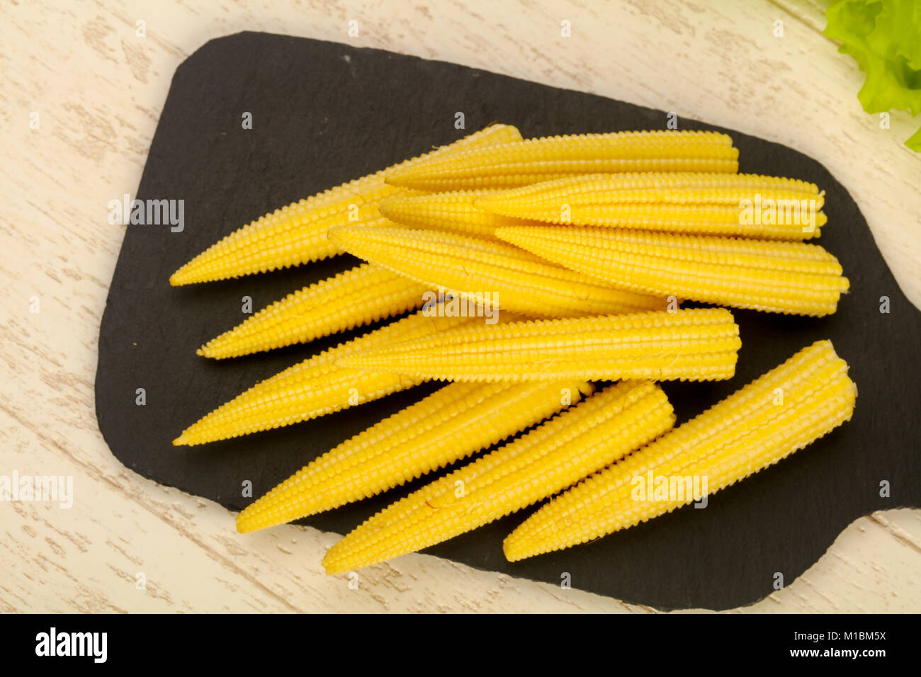 Young raw baby corn Stock Photo - Alamy