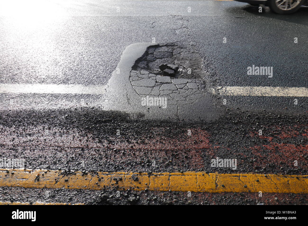 Pothole In The Road Stock Photo - Alamy