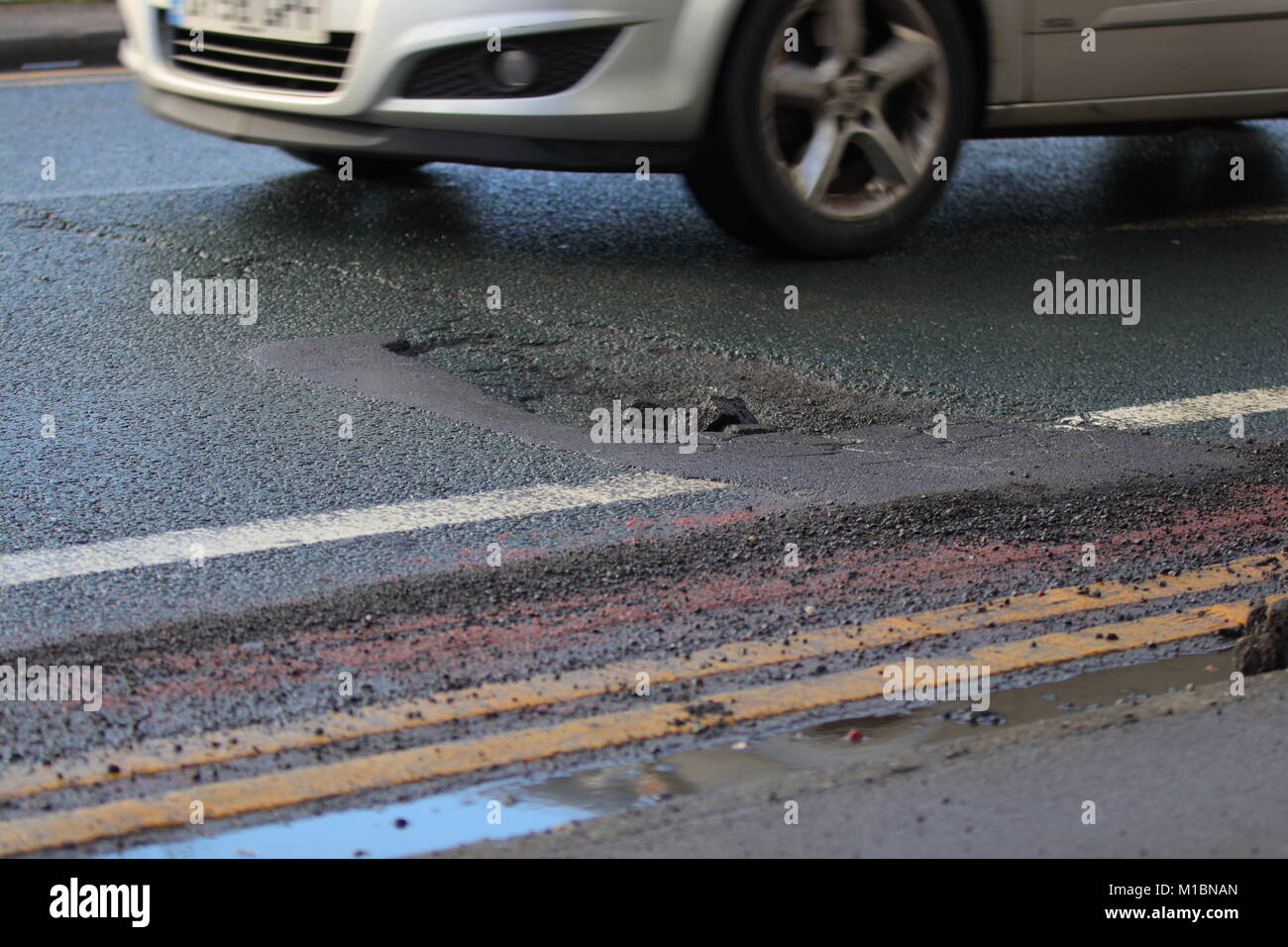 Pothole In The Road Stock Photo - Alamy