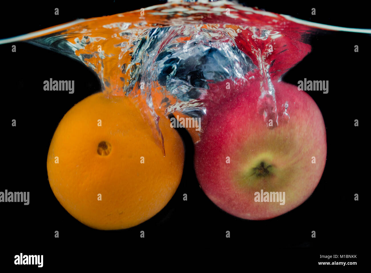 fruit falling through water Stock Photo - Alamy