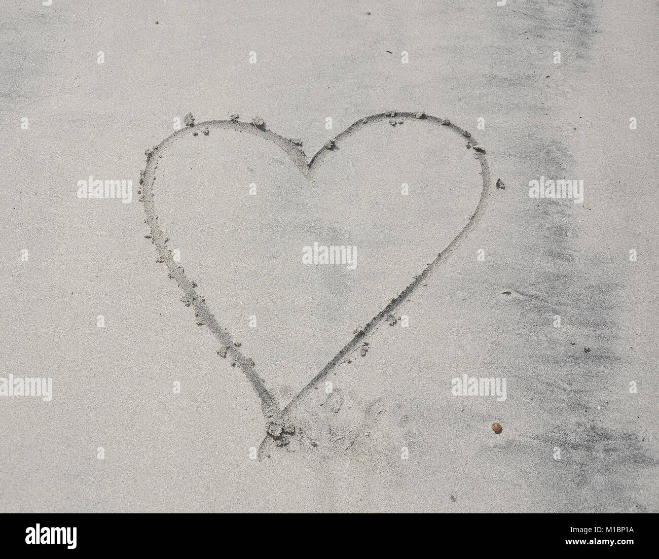 Heart on sand Stock Photo - Alamy