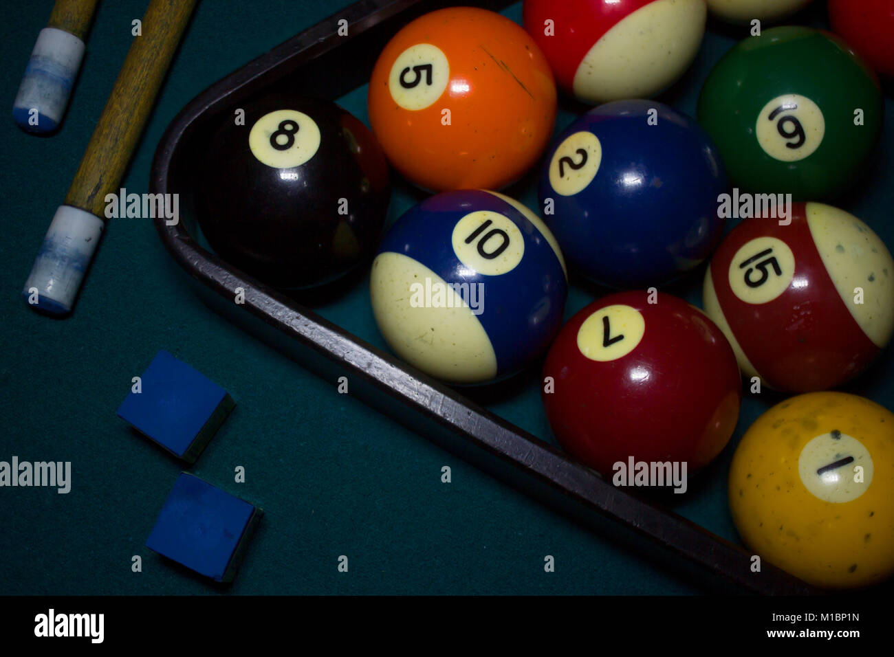 Top view of billiard balls, cue sticks, chalk on green billiard table ... Top view of billiard balls, cue sticks, chalk on green billiard table ...