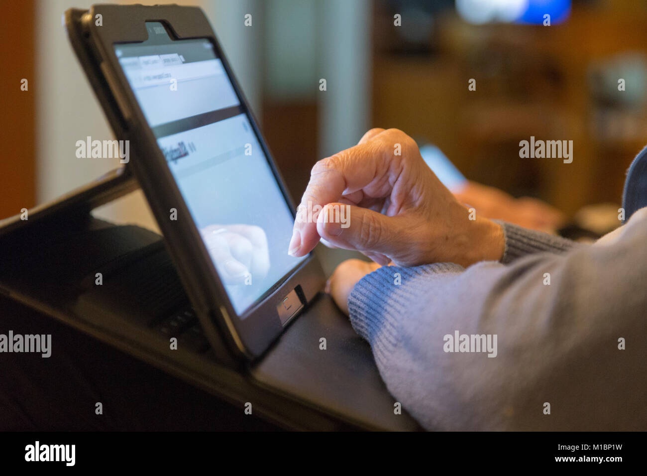 Seniors using technology Stock Photo - Alamy