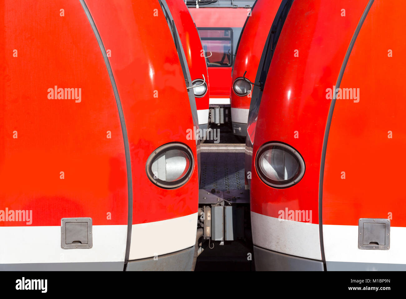 red passenger trains close up background Stock Photo - Alamy