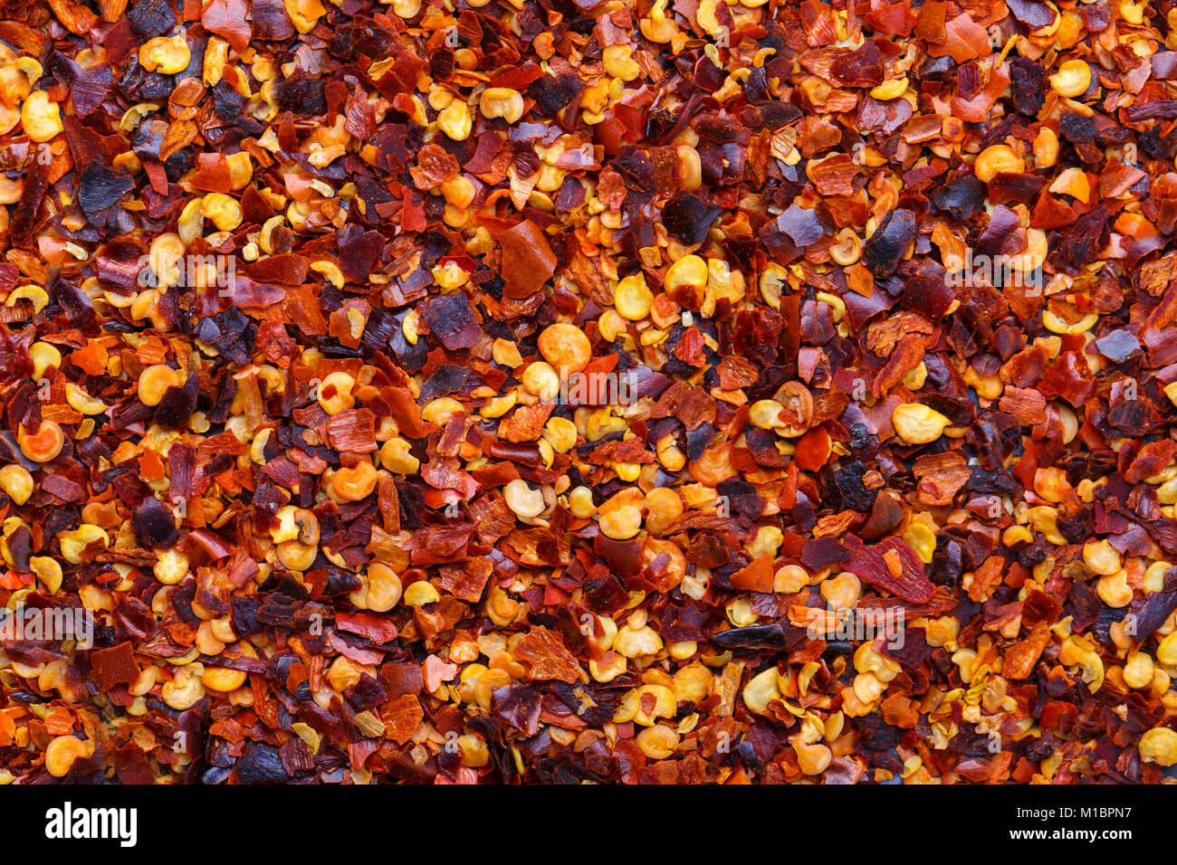 Red chili peppers texture background, macro overhead Stock Photo - Alamy