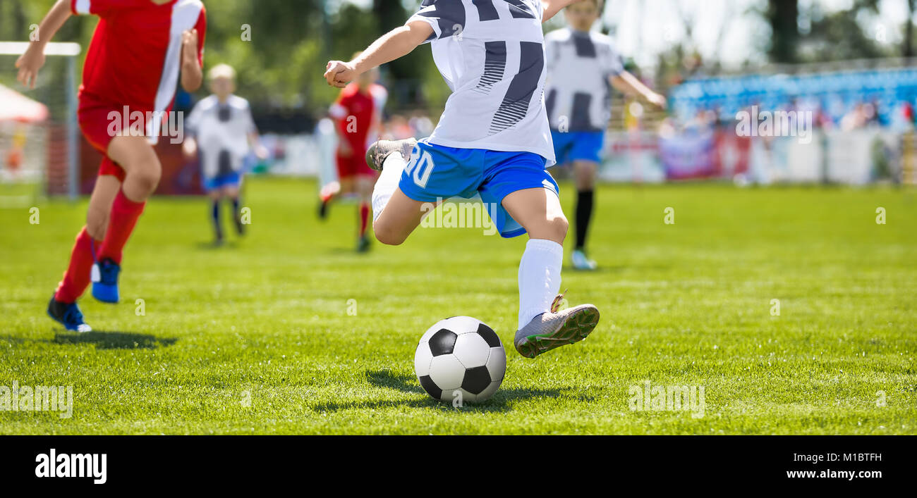 Soccer Football Kick. Young Player Kicking Soccer Ball. Footballers ...