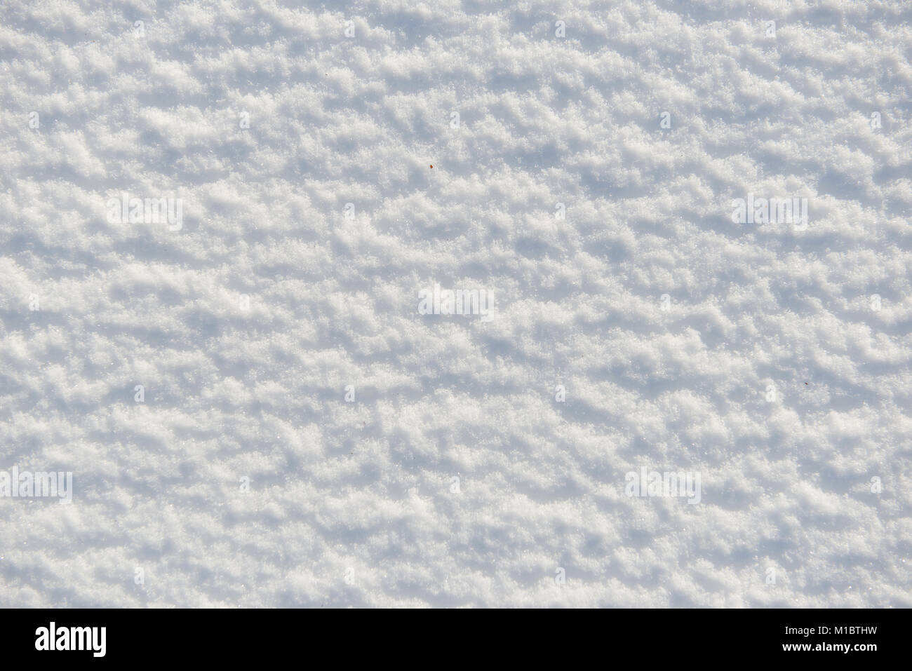 snow for texture or background at sunny day, bright light with shadows ...