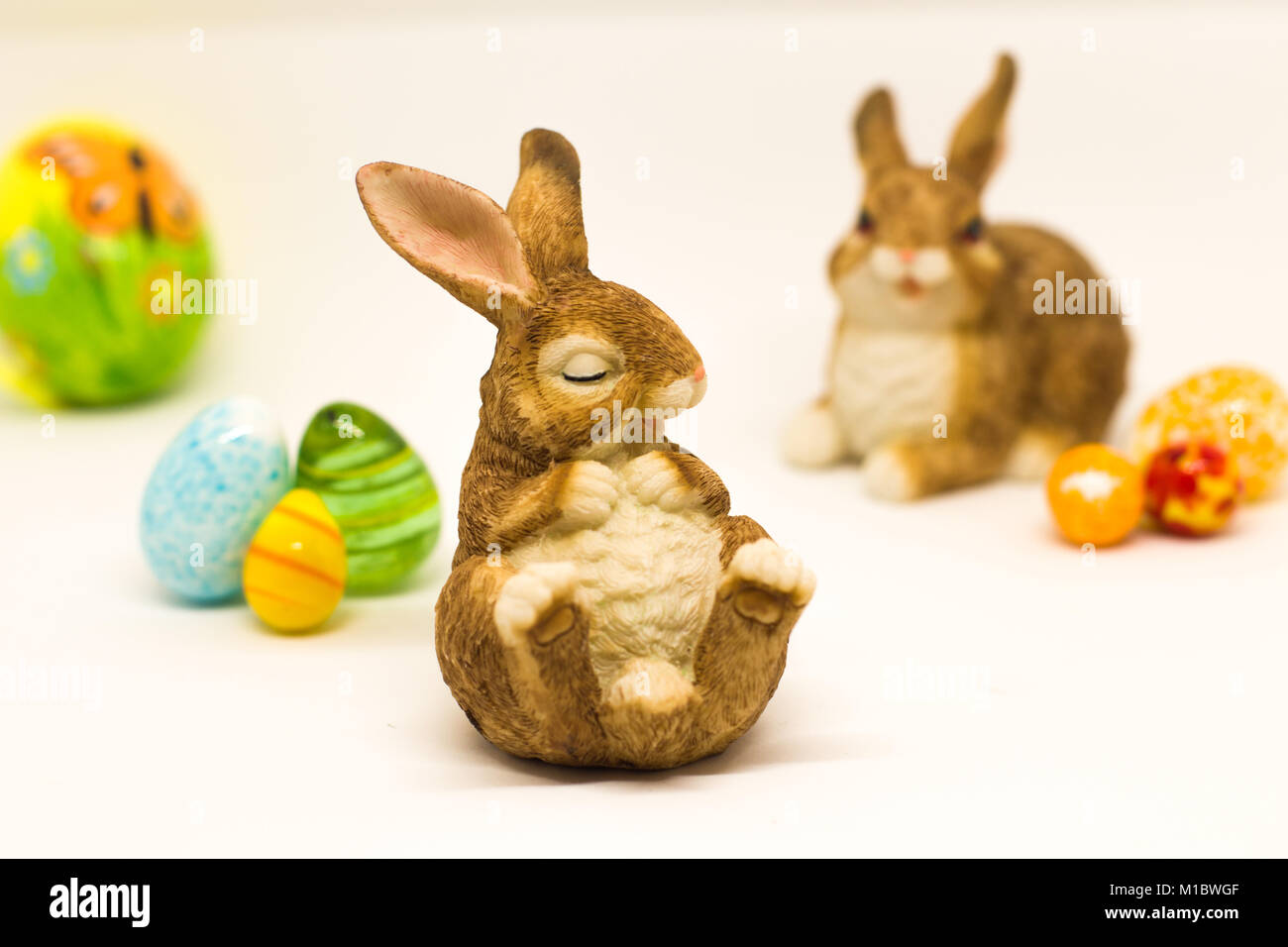 Sweet adorable sleepy easter bunny with friend and glass easter eggs ...