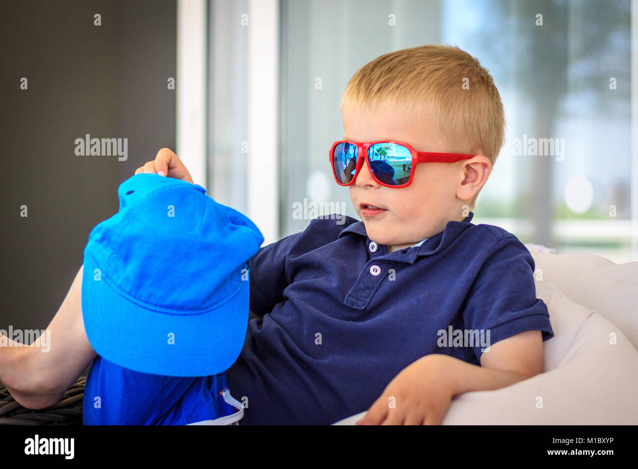 Boy child cap sunglasses hi-res stock photography and images - Alamy