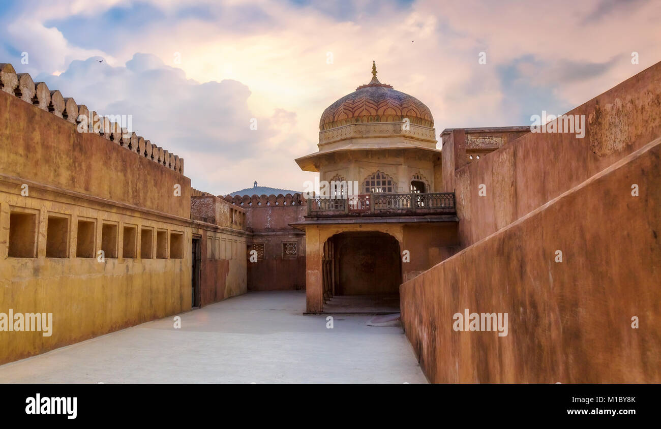 Amber Fort Jaipur Rajasthan at sunset with moody sky. Amber Fort is a ...