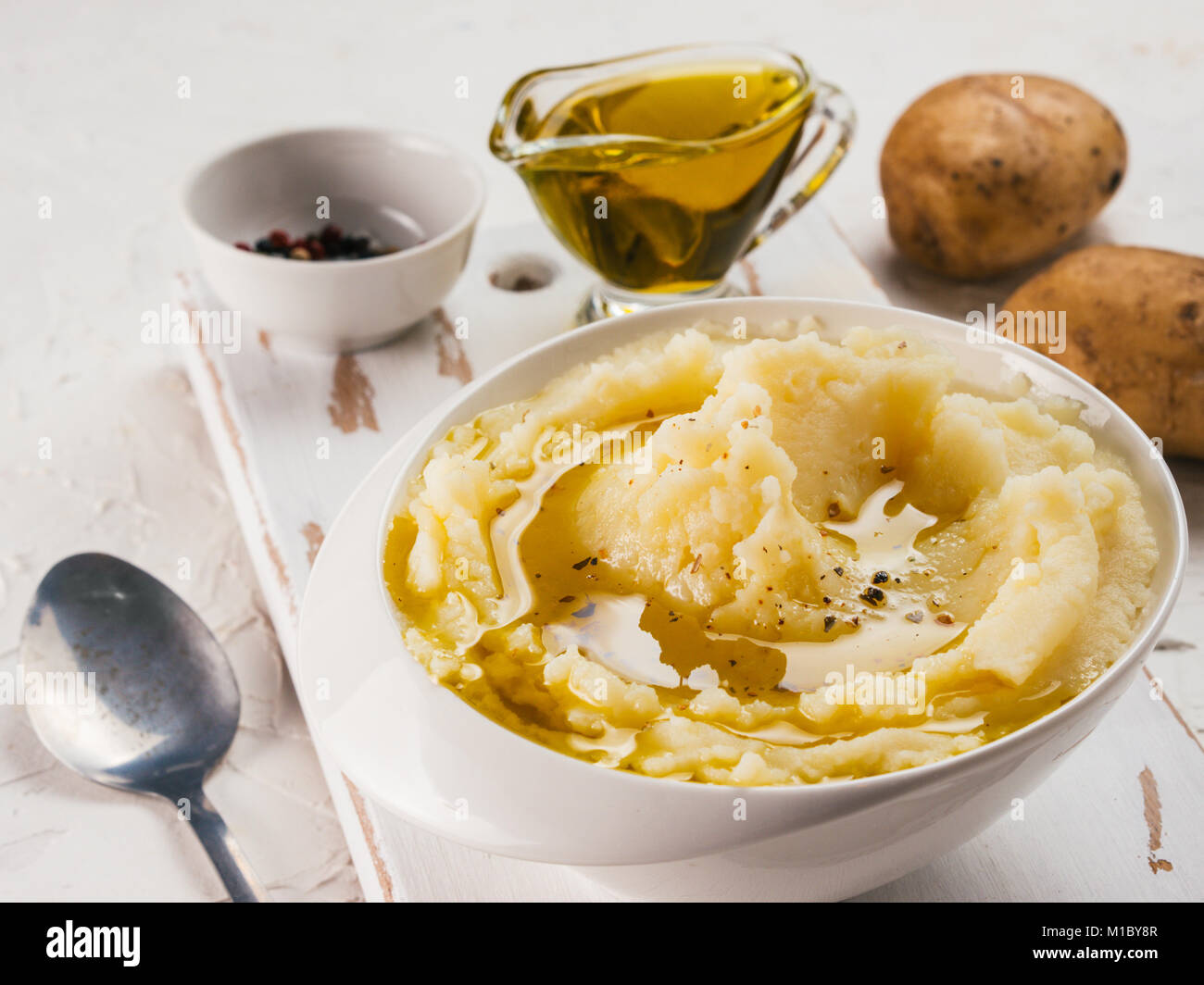 Mashed potatoes on white concrete background Stock Photo - Alamy