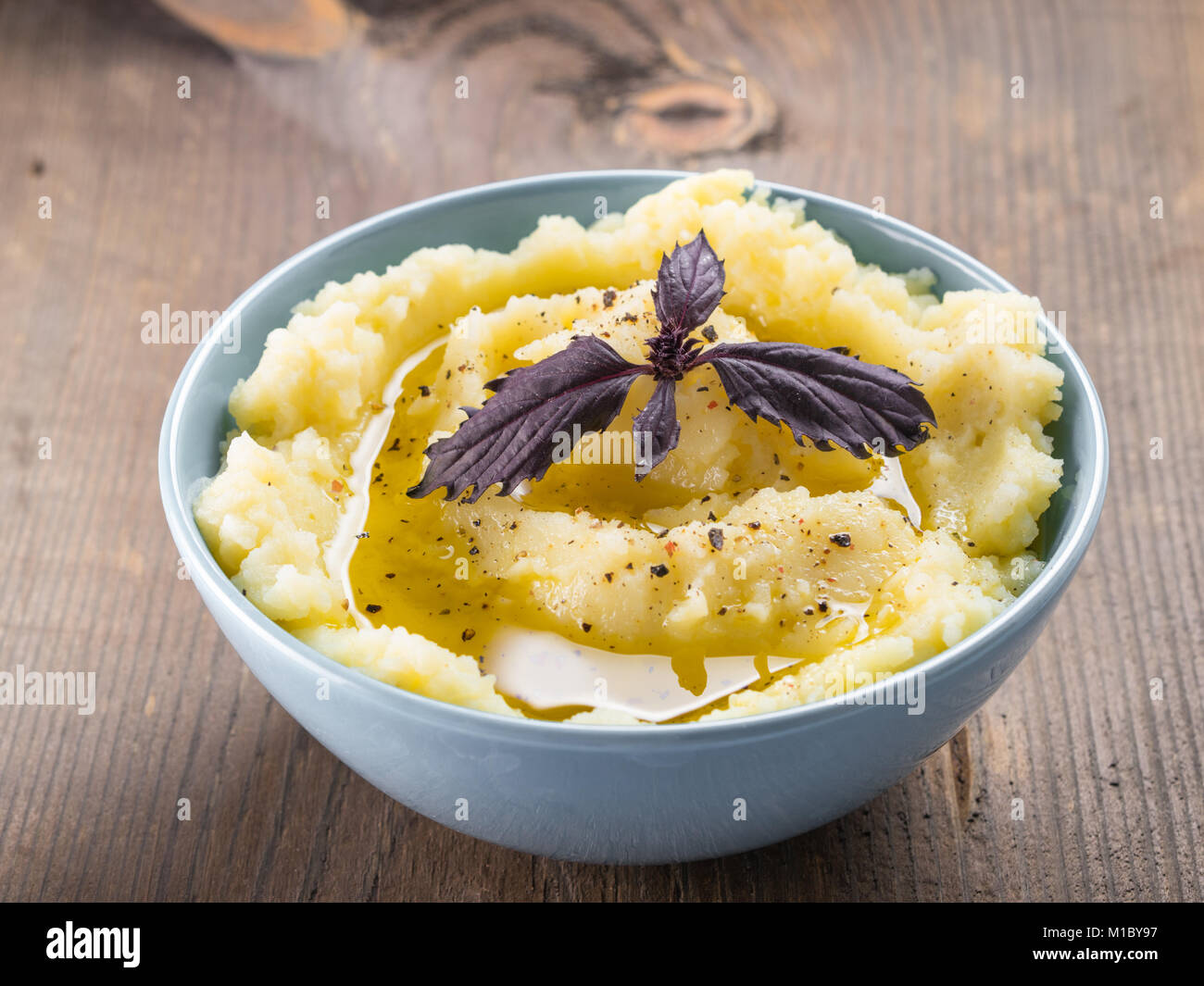 Mashed potatoes on wooden background Stock Photo - Alamy