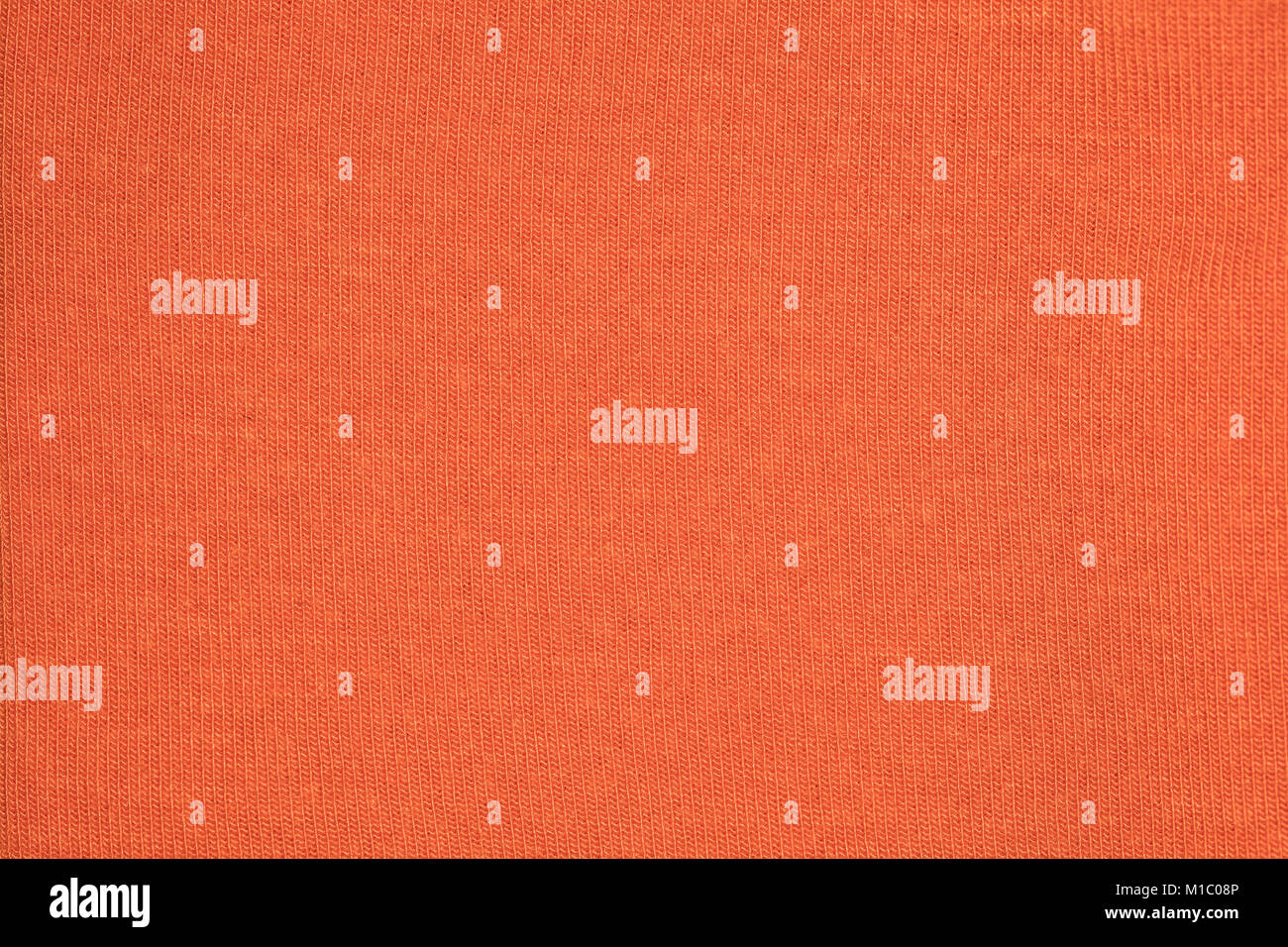 fabric in orange color, close-up on the stitch Stock Photo - Alamy