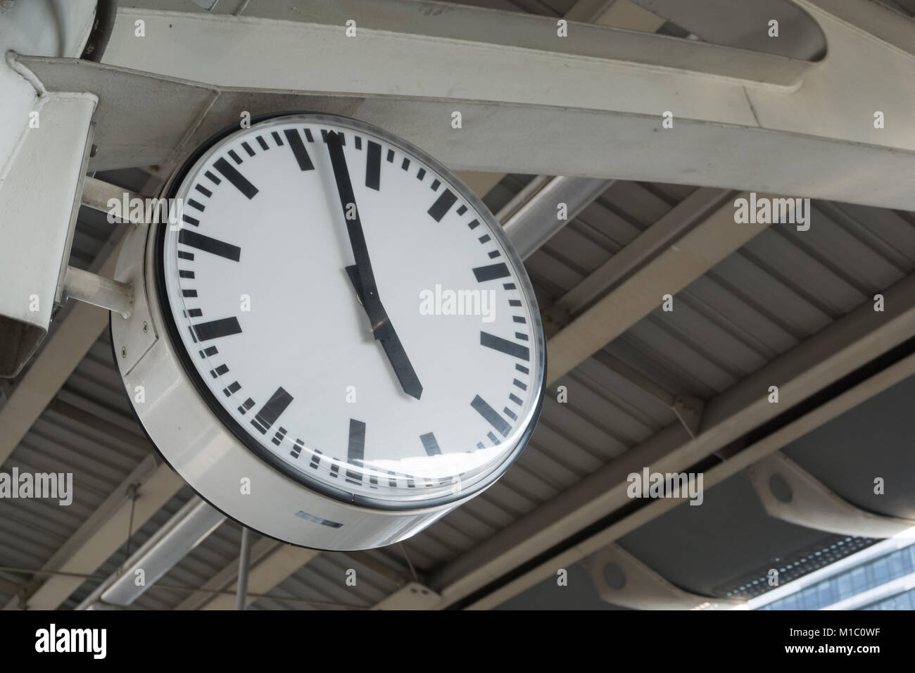 Analog clock at metro train station in daytime Stock Photo - Alamy