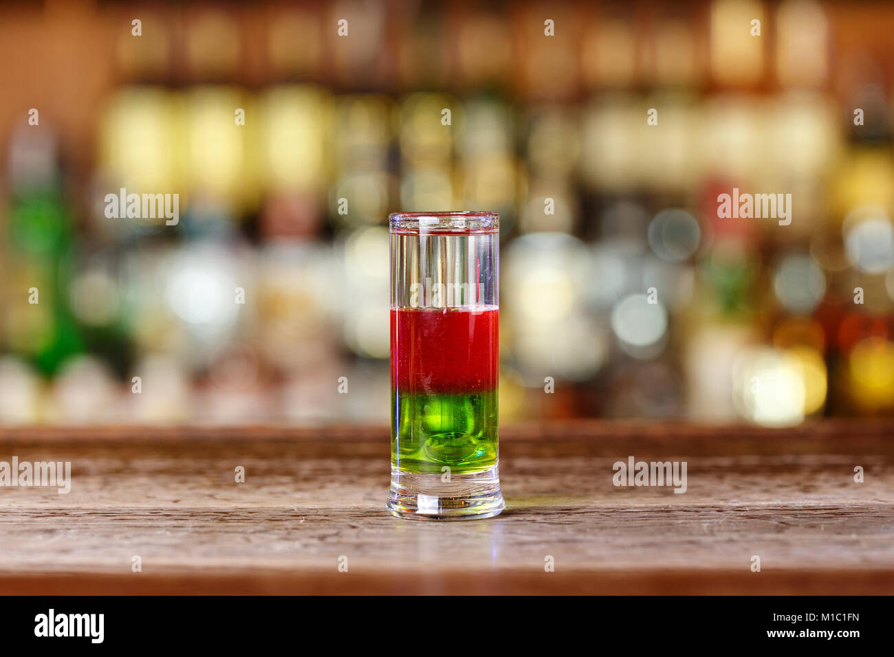 Spicy cocktail shot Eurasia, based on melon liquor, cranberry tincture ...