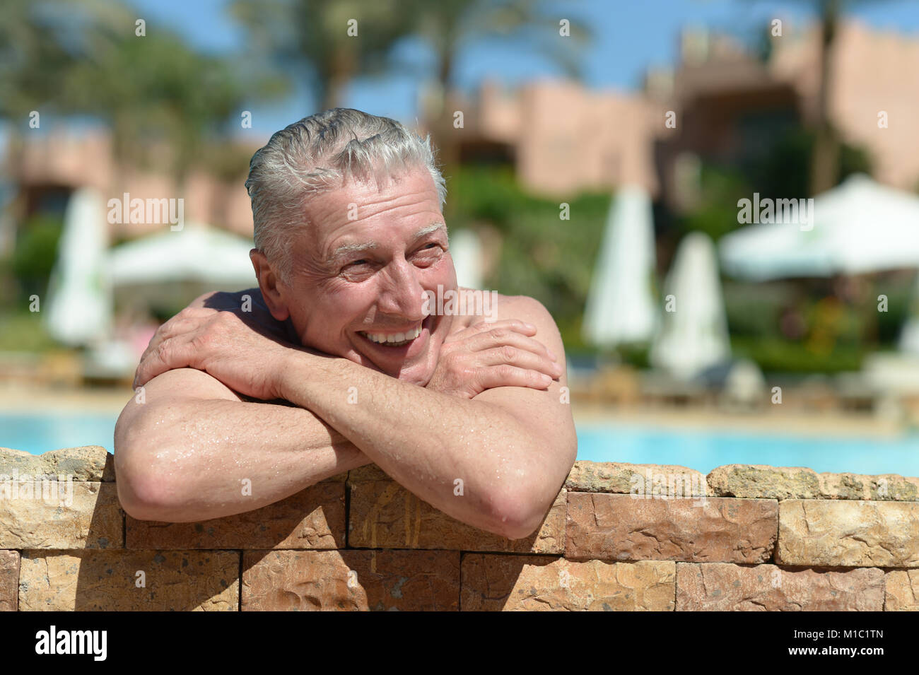 Senior man in swimming pool Stock Photo - Alamy