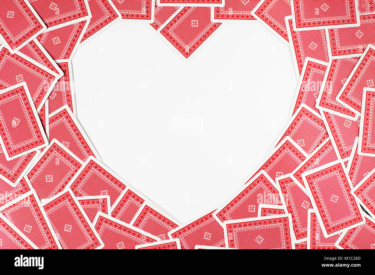 Heart shape made of red playing cards Stock Photo - Alamy