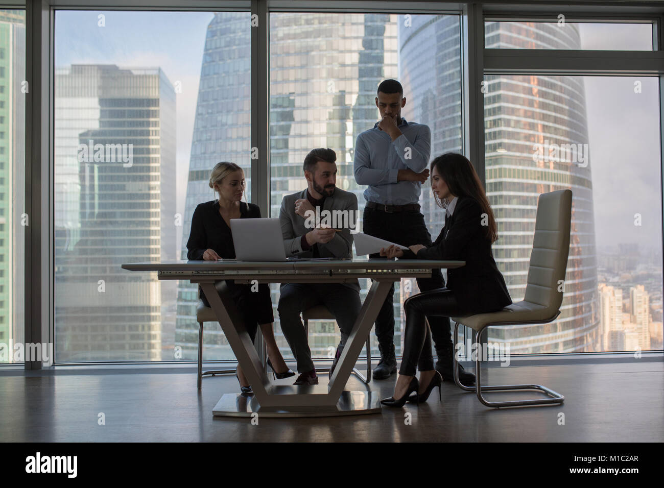 Business people working in an office on a background of panoramic ...