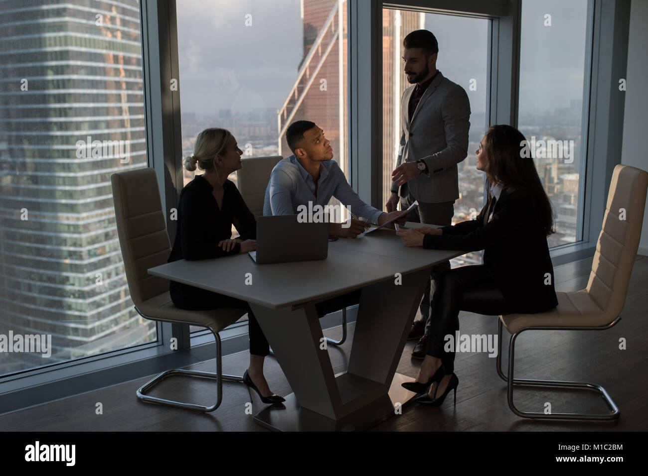 Business people working in an office on a background of panoramic ...