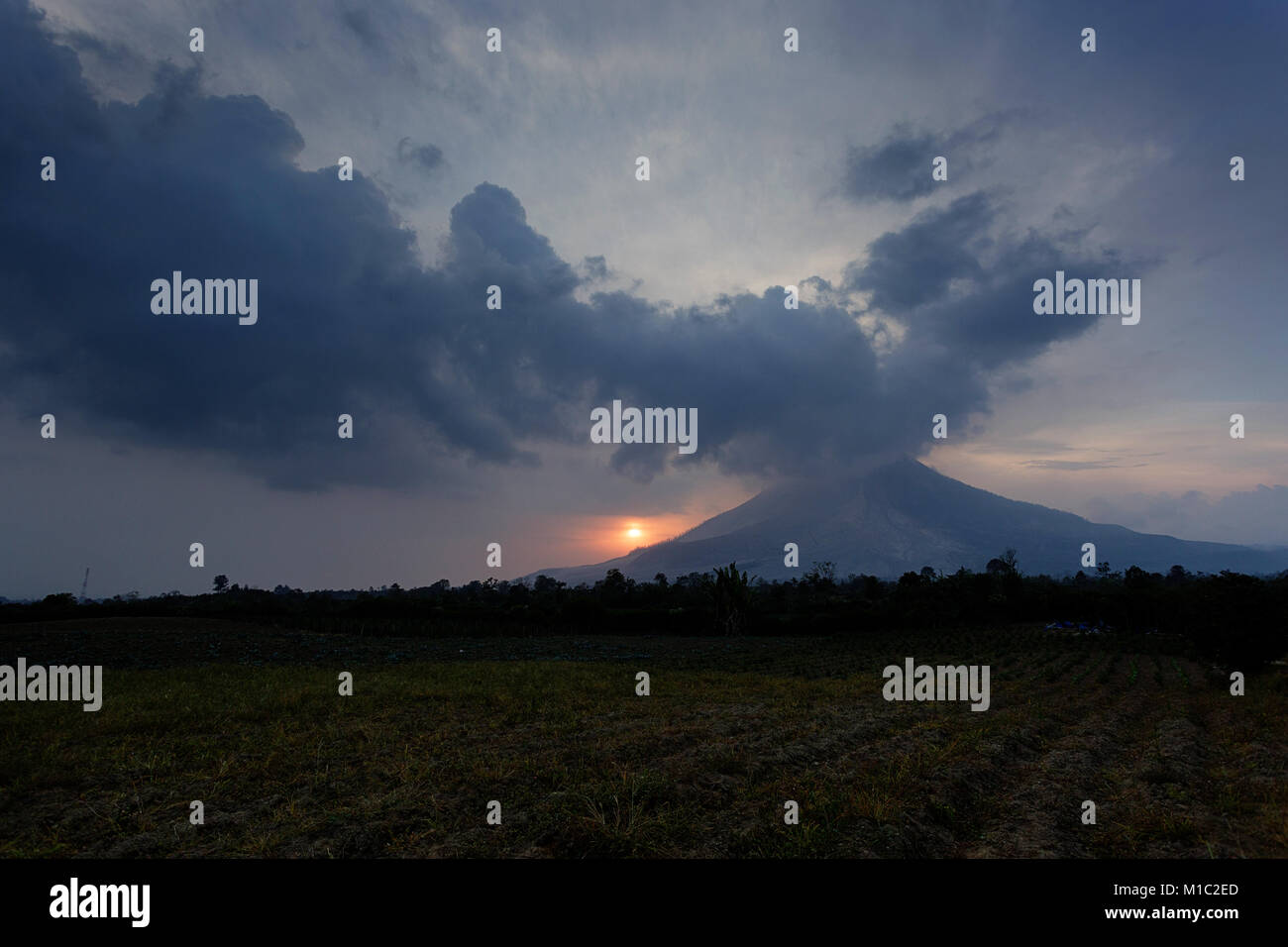 Colourful Sunset over Sinabung volcano in the Karo Highlands of North ...