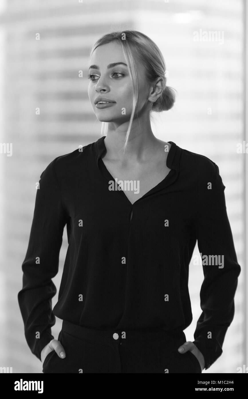 Beautiful Business Woman Standing Near A Window In The Office Stock