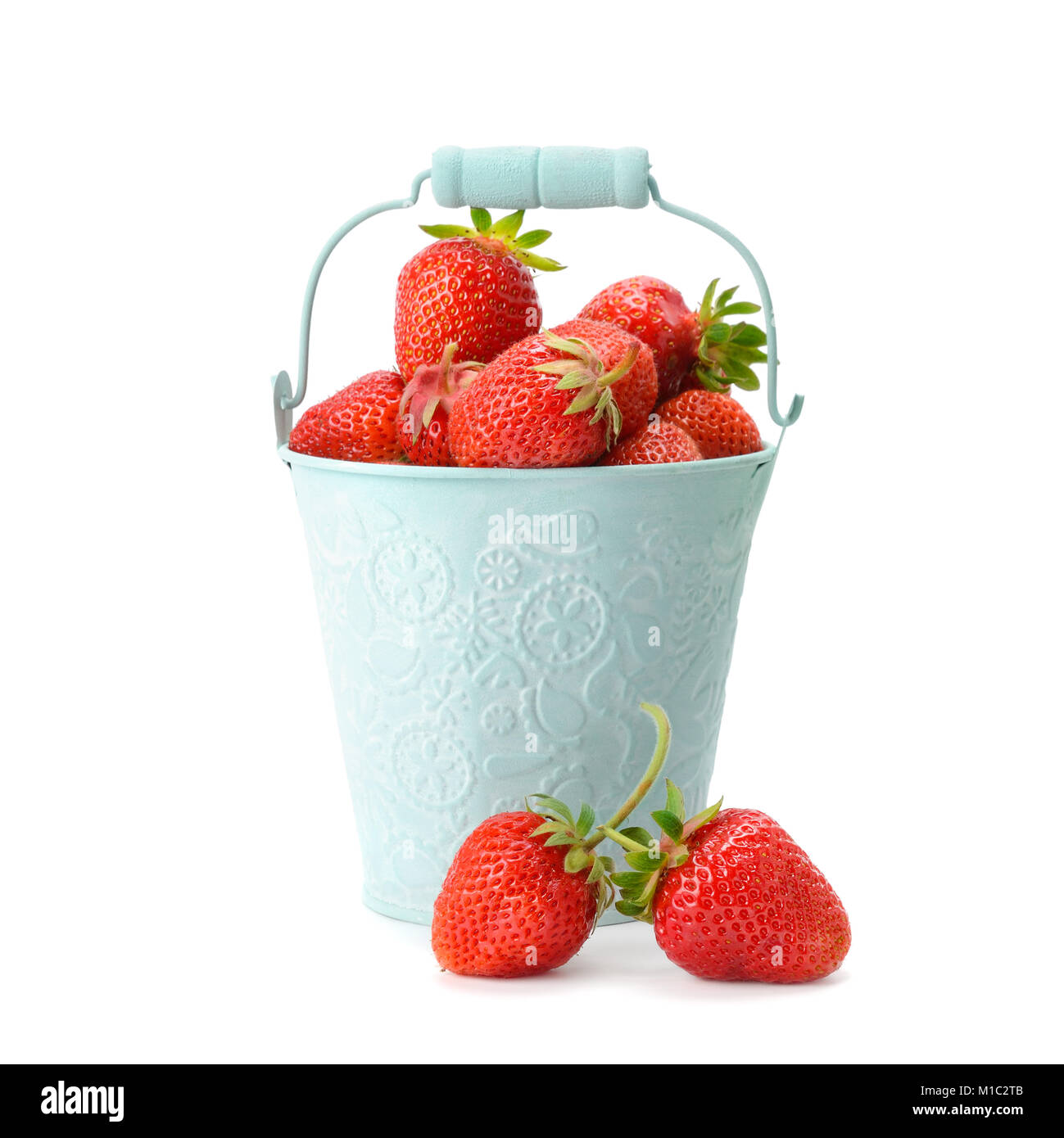 Strawberries in a bucket isolated on a white background Stock Photo - Alamy