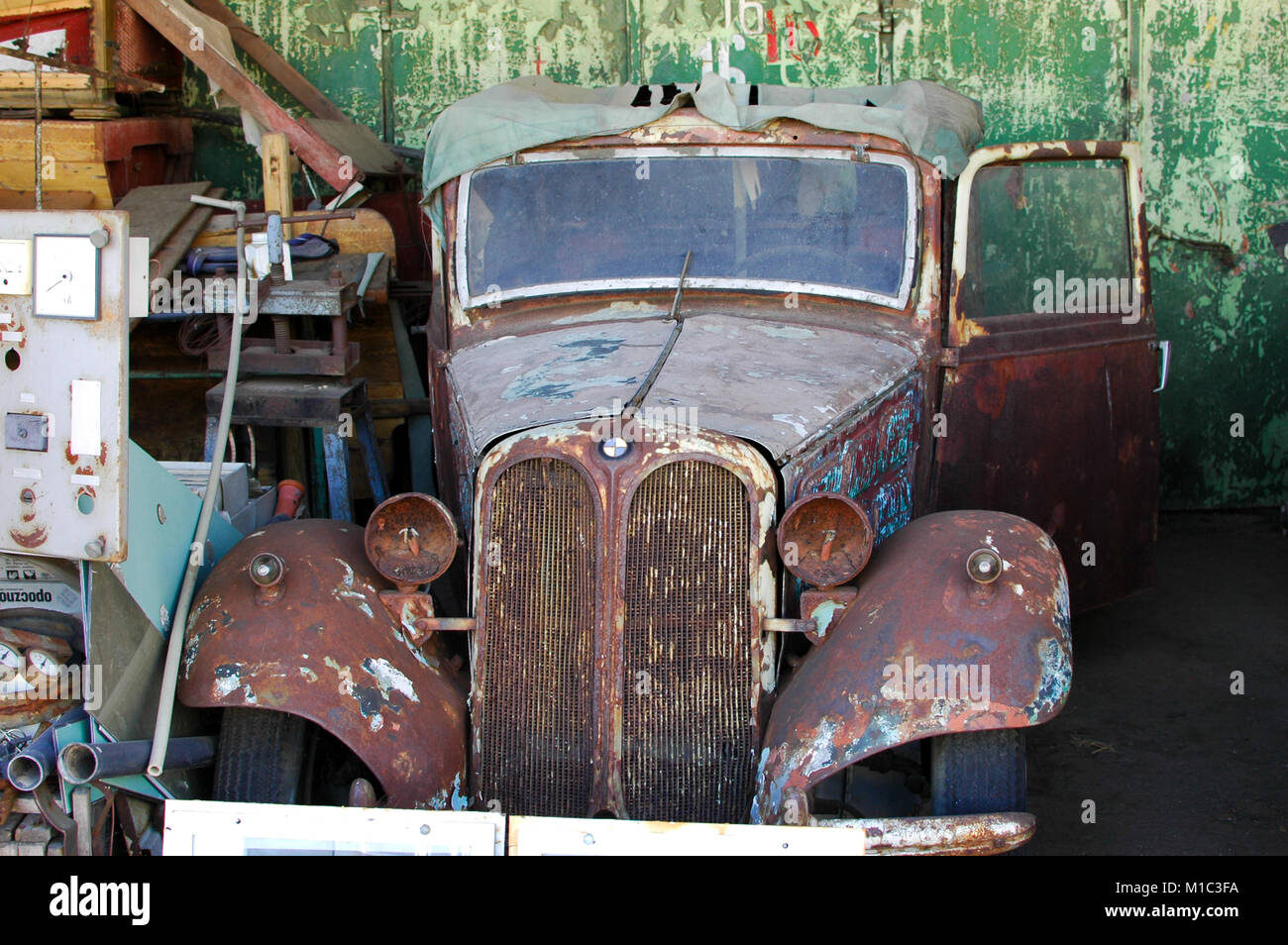 old rusty car with open door, front view, close up Stock Photo - Alamy