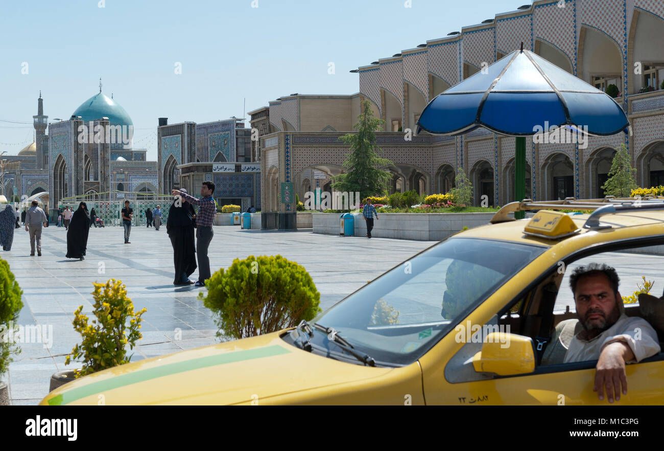 Iranian taxi driver on the street of Mashhad near the Imam Reza shrine ...