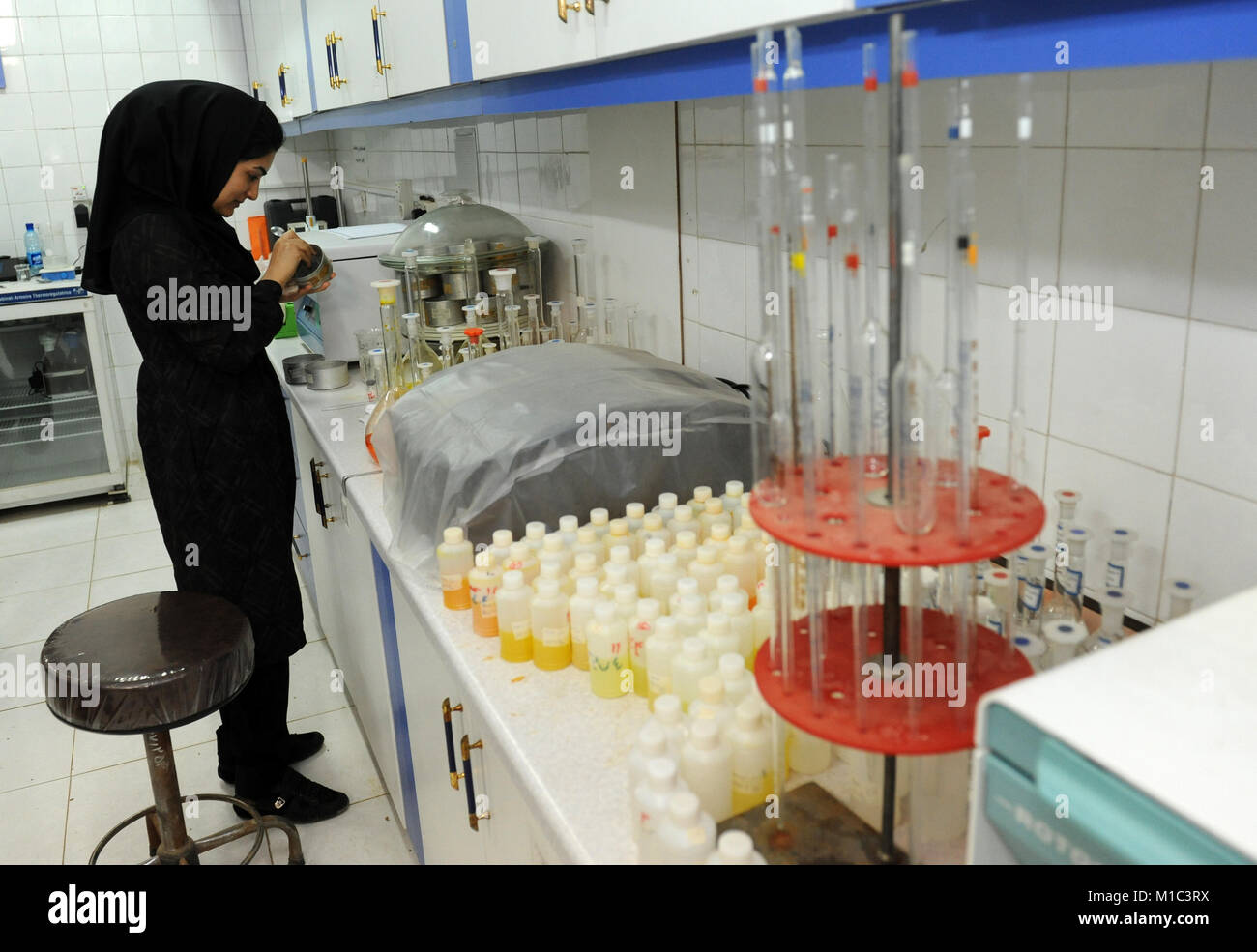 Iranian woman student in the laboratory at the Shahid Chamran ...
