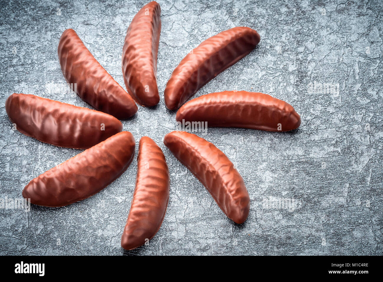 Confectionery concept Chocolates candy stuffing fruit jelly form of ...