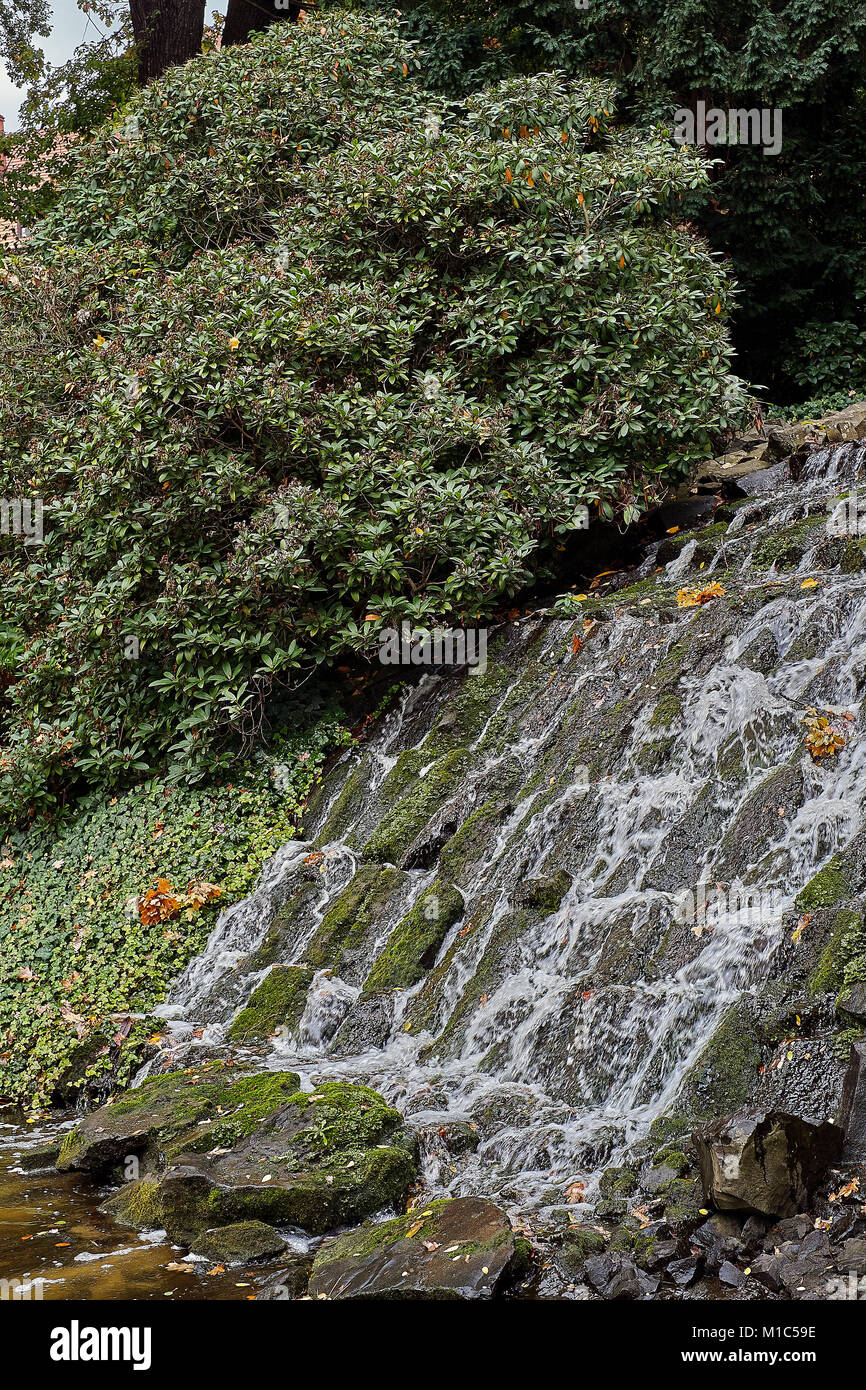 Famous waterfall in Botanical garden of Wroclaw, Poland. City landscape ...