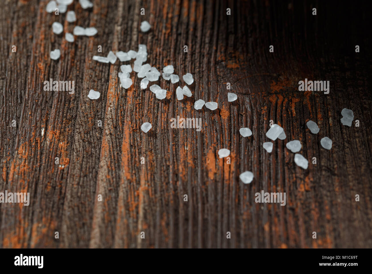 Sea salt grains on the black background Stock Photo - Alamy