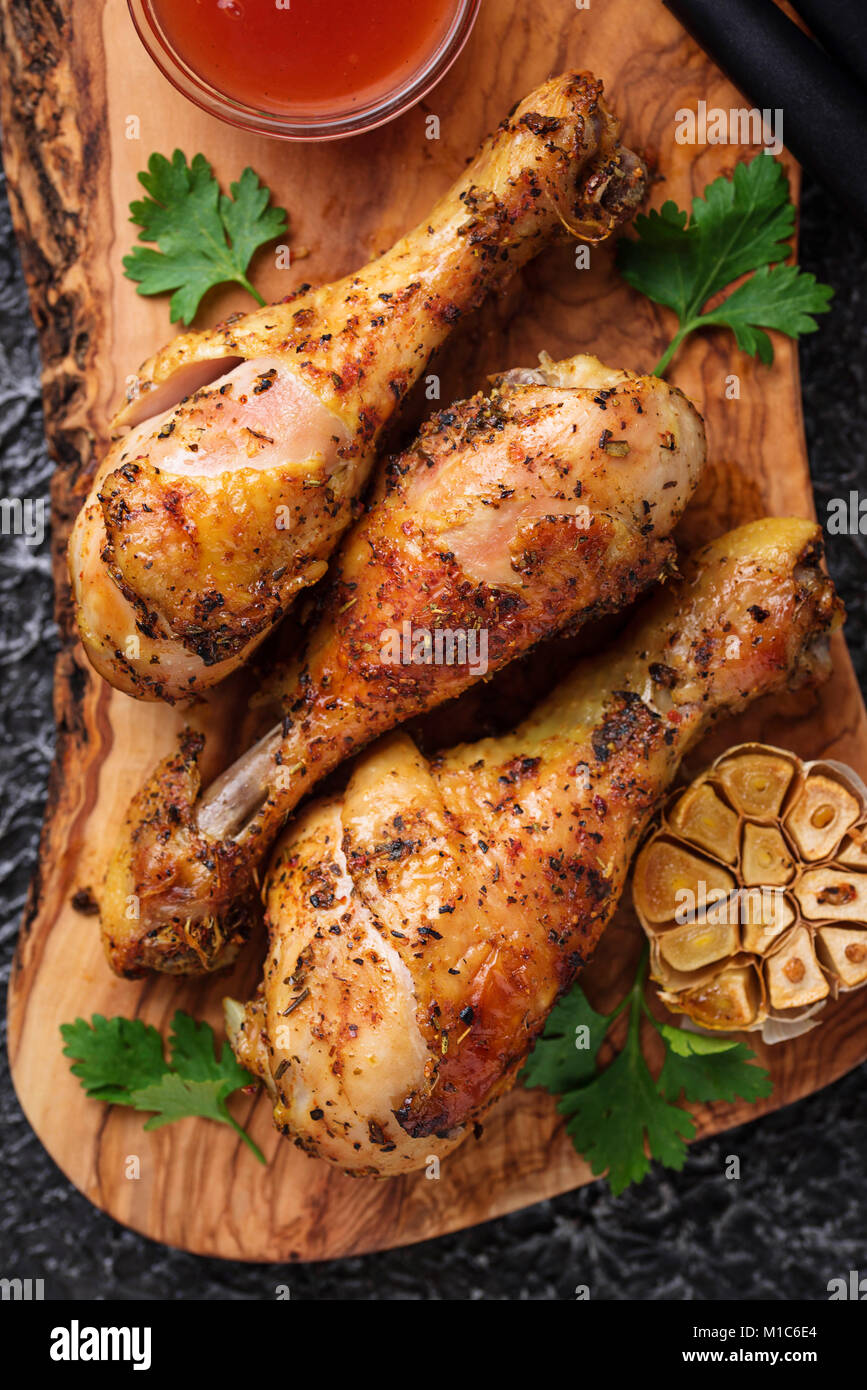 Grilled chicken legs with spices and garlic. Top view Stock Photo - Alamy