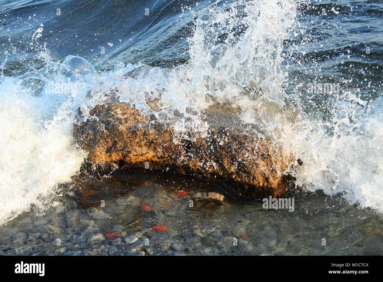 Water Hitting A Rock at Lake Ontario Park Stock Photo - Alamy