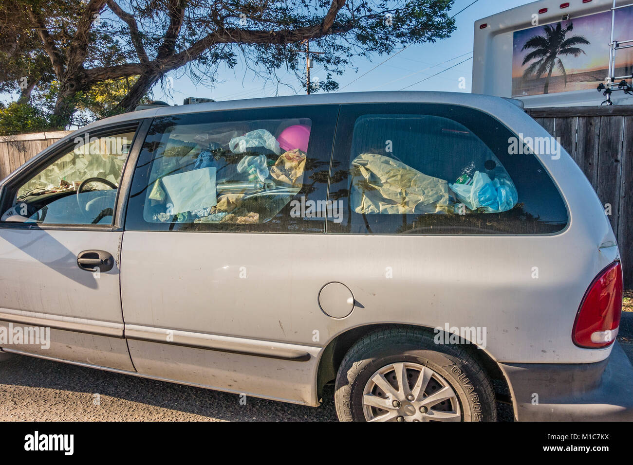 A Dodge van stuffed with the worldly goods of a homeless person living ...