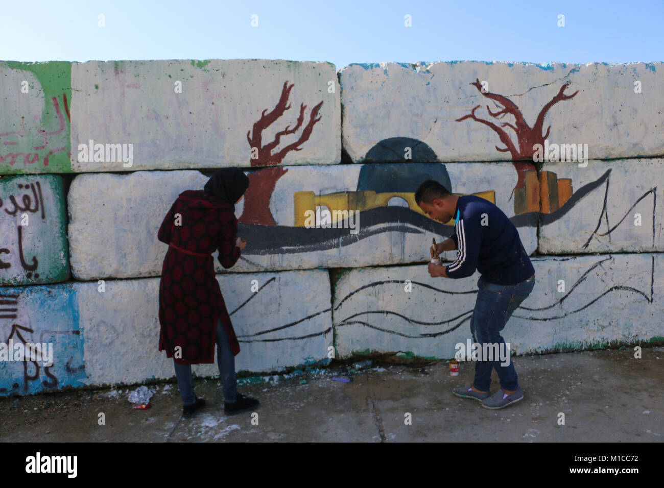 Jerusalem. 29th Jan, 2018.Artists Bakr Omar and Rania Murad paint ...